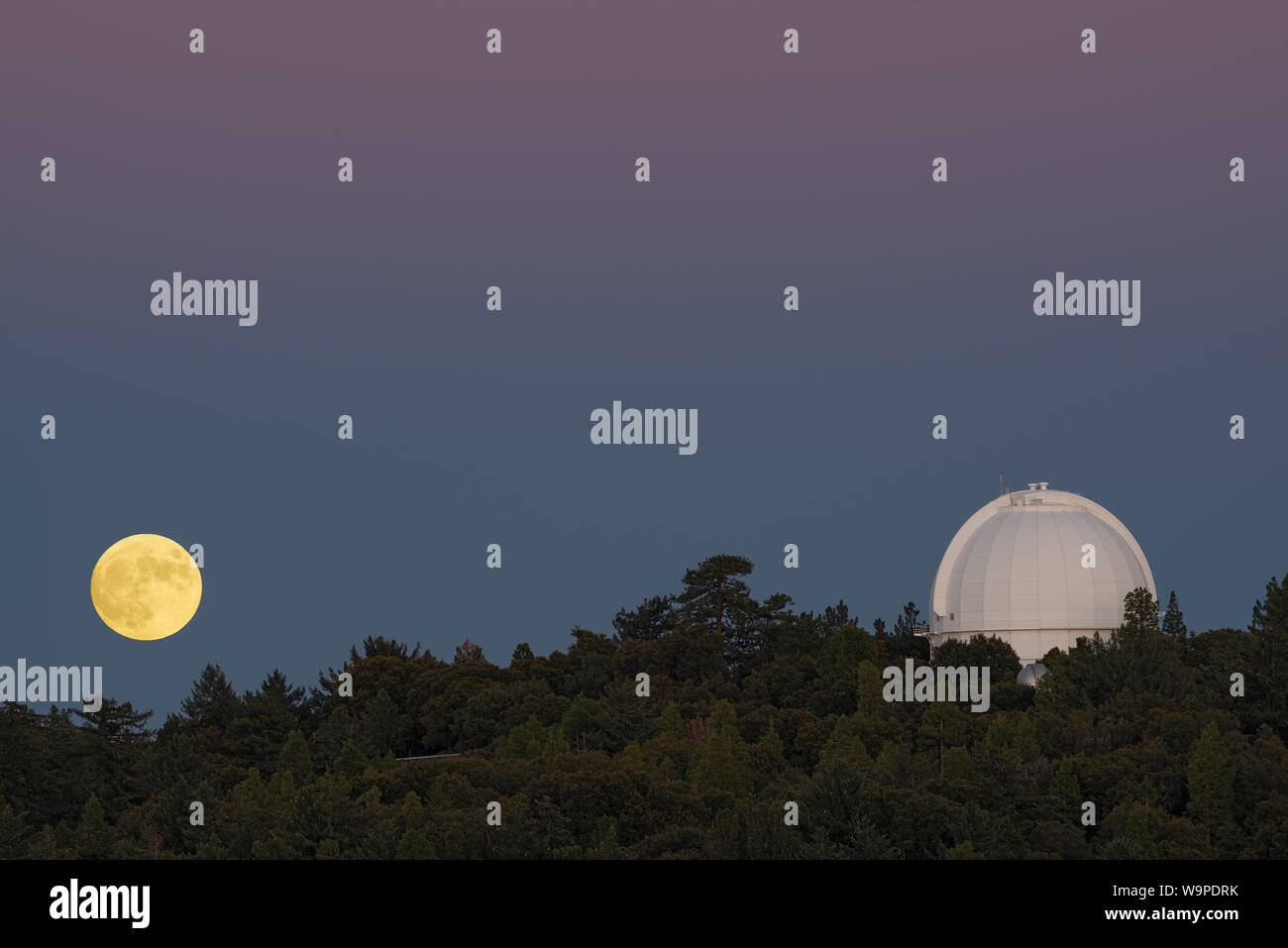 Full moon rising at Mt Wilson Observatory in California. Mt Wilson is ...