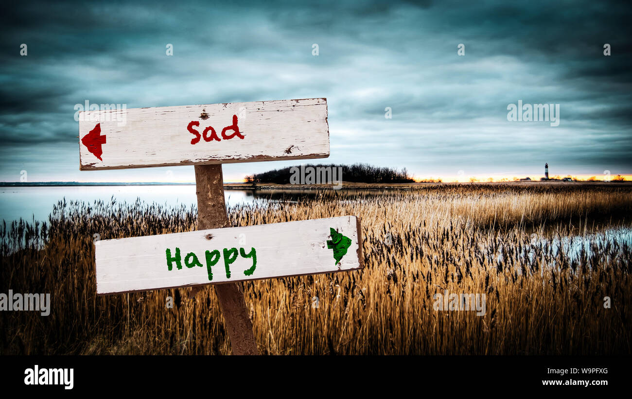 Street Sign the Direction Way to Happy versus Sad Stock Photo - Alamy
