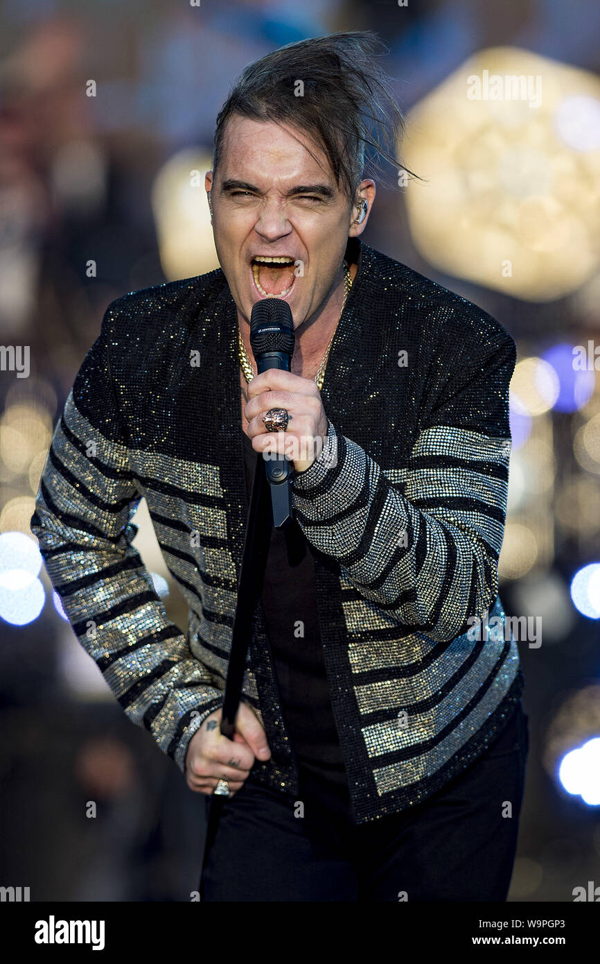 LONDON, ENGLAND: Robbie Williams performs on the Great Oak Stage at the ...