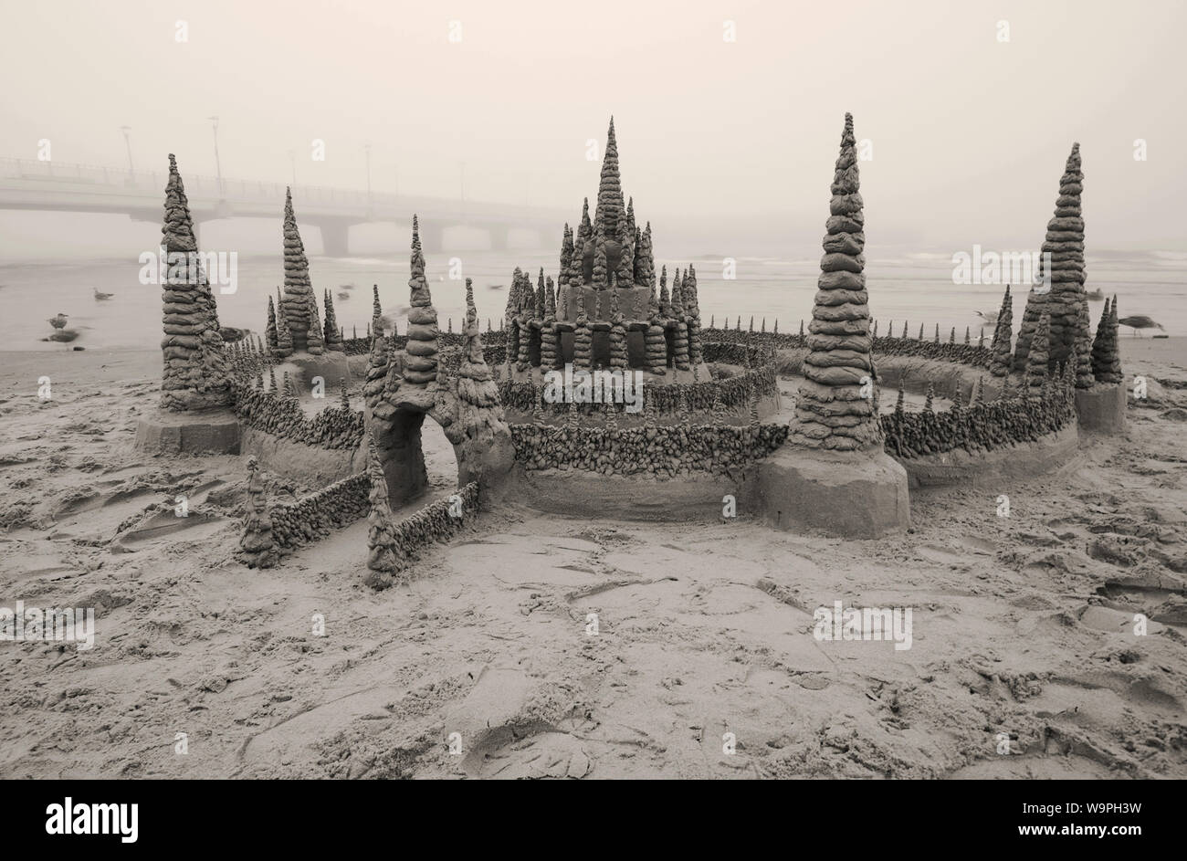 Sandcastle on the Baltic Sea, fog, beach, pier, Kolobrzeg, Poland Stock ...
