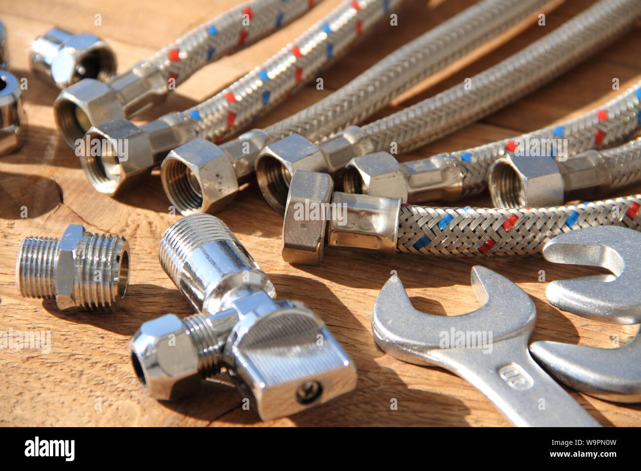 flexible hoses for sanitary installation Stock Photo - Alamy