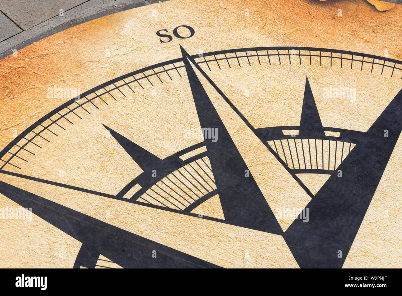 The compass is drawn on a concrete slab. The concept of the earth ...