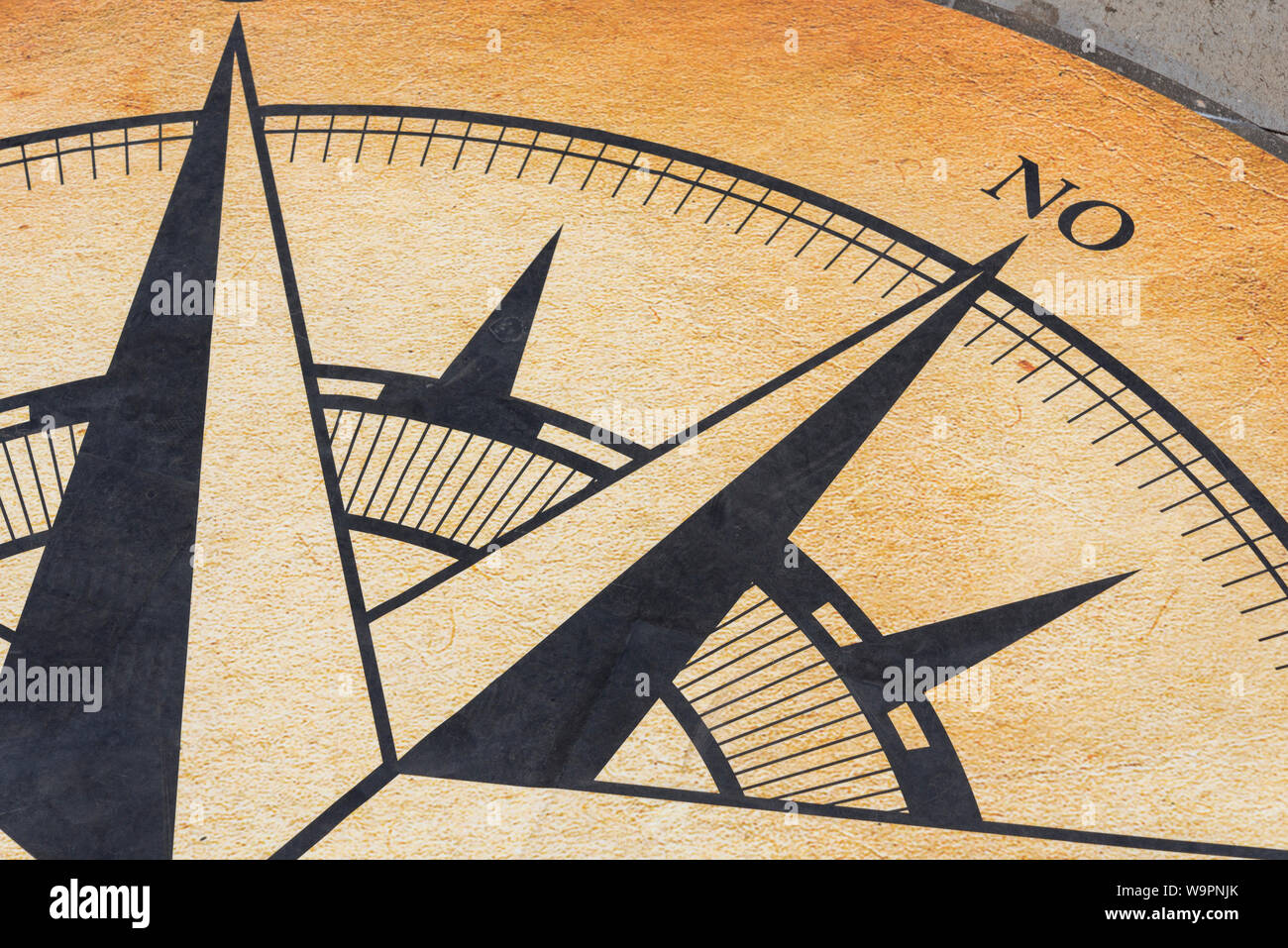 The compass is drawn on a concrete slab. The concept of the earth ...