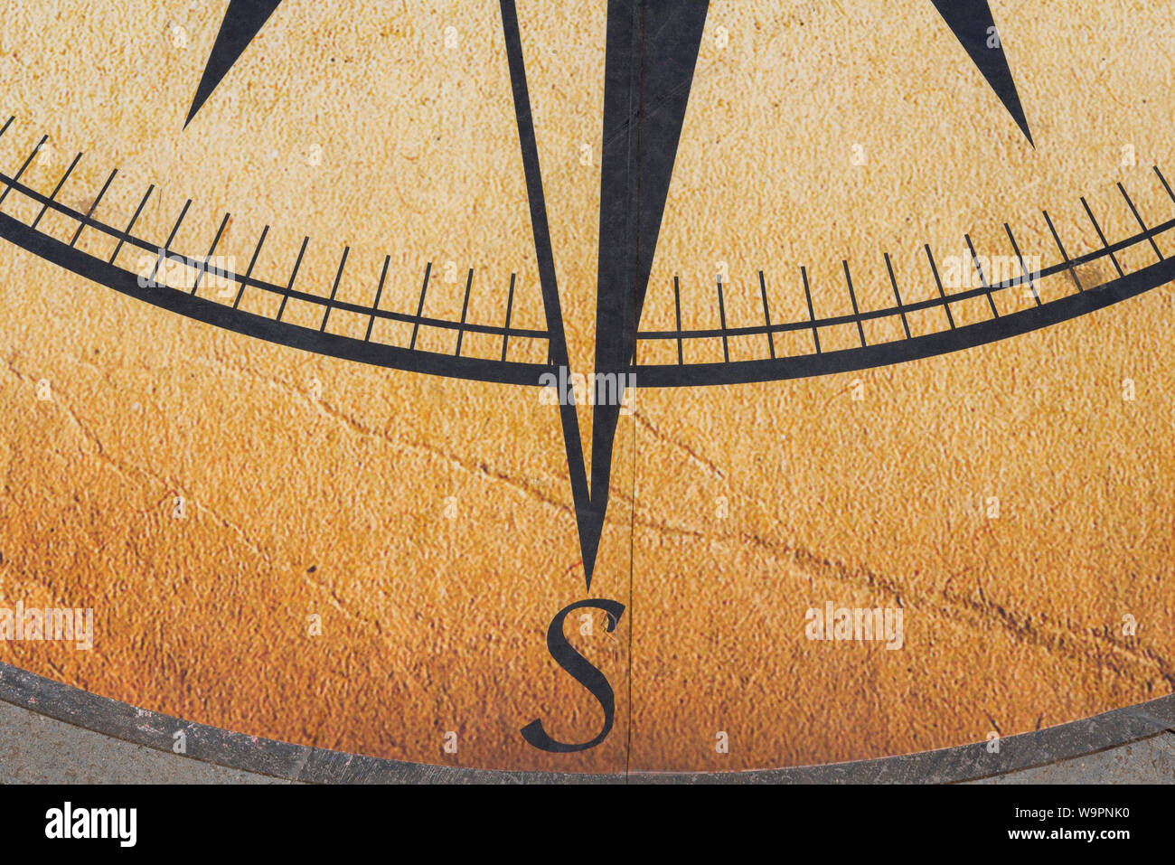 The compass is drawn on a concrete slab. The concept of the earth ...