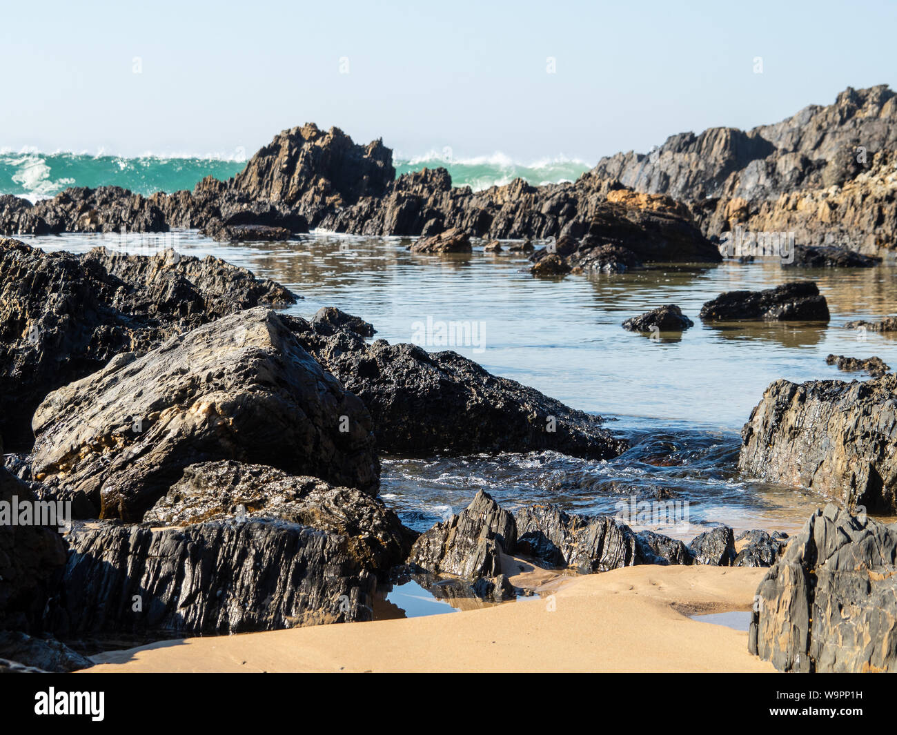 Stunning coastal seascape as a large barrel wave is about to crash into ...