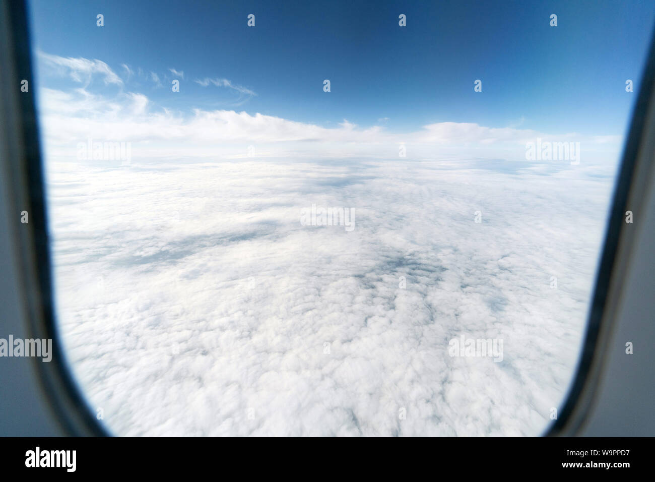 Airplane window view to cloudy sky. Beautiful landscape from aircraft ...