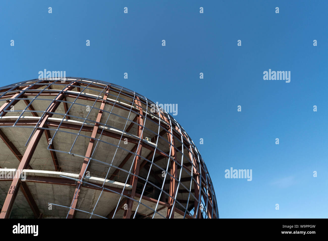 Unfinished sphere shape building, copy space. Construction of ...