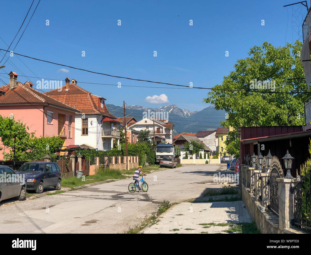 STRUGA, MACEDONIA - MAY 26, 2018: Street in Struga where boy is on bike ...