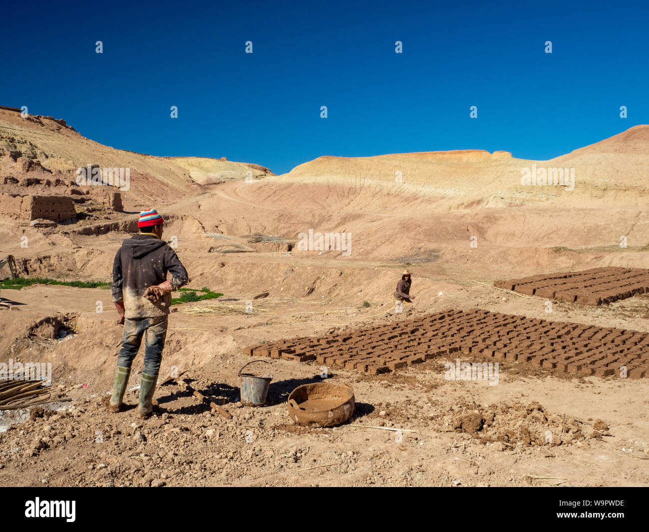 Morocco clay mud bricks makers, adobe brickworking workers, dry and wet ...