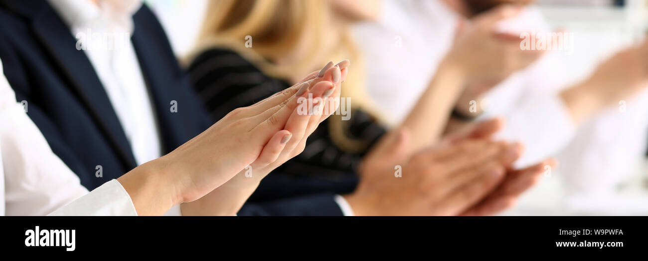 Group of people clap their arm in row during Stock Photo - Alamy