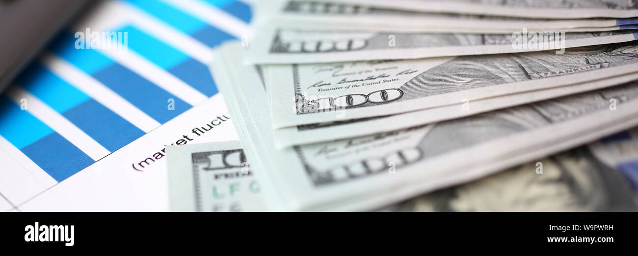 Silver calculator with gray keyboard is lying on desk Stock Photo - Alamy