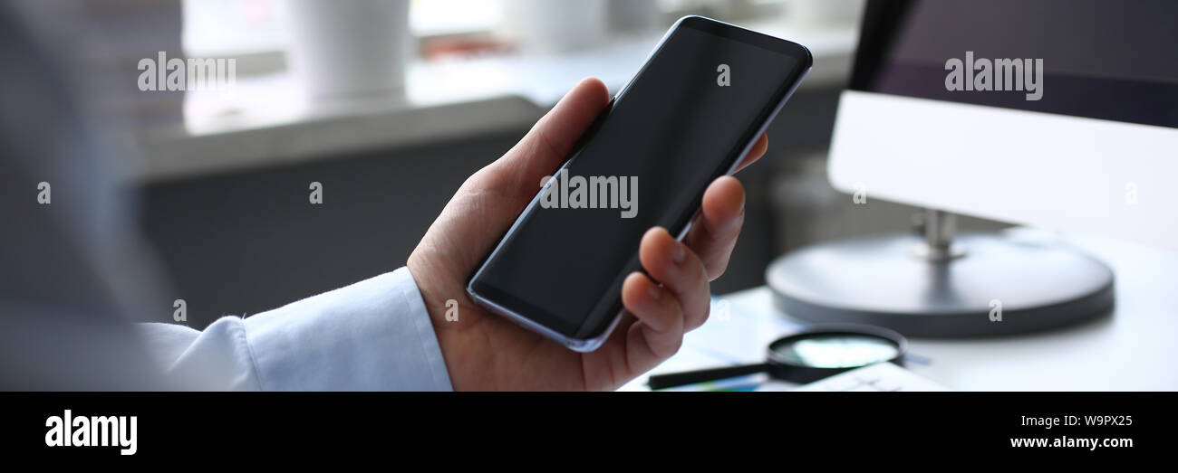 Businessman hipster holds telephone background Stock Photo - Alamy