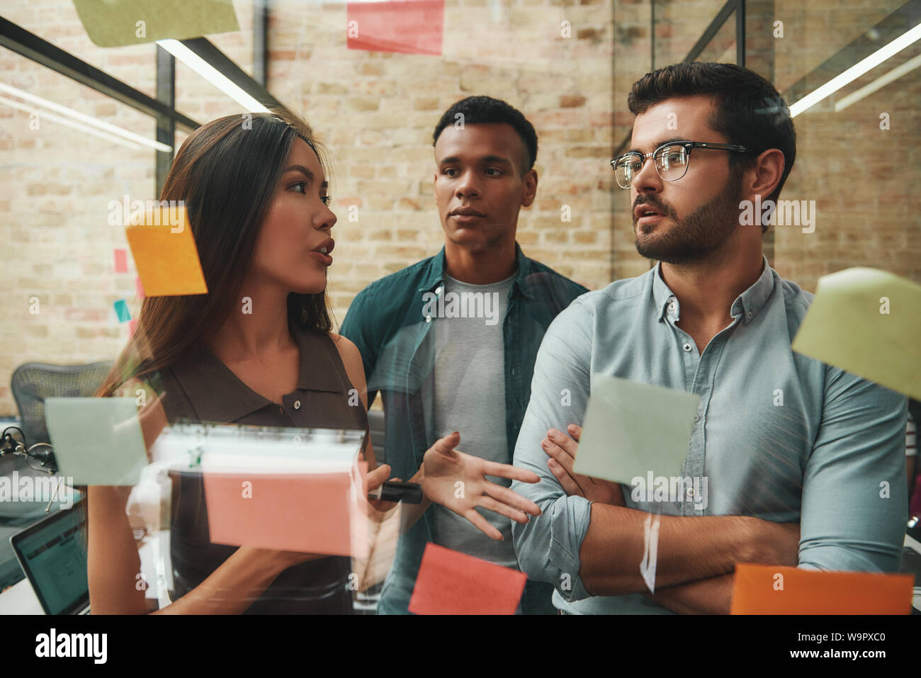 Kanban board. Cheerful male and female colleagues planning working ...