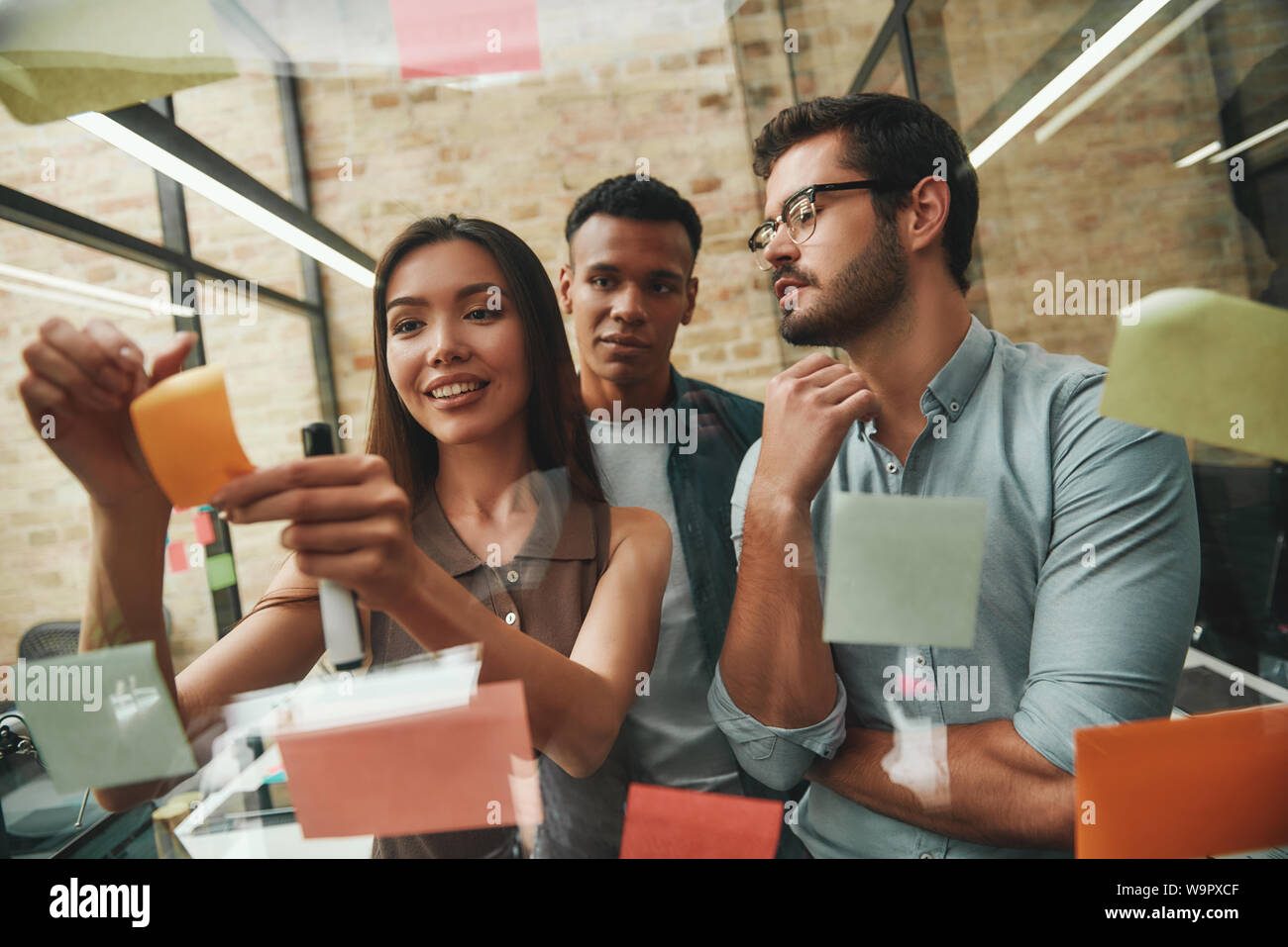 New strategy. Mixed group of business people planning working process ...