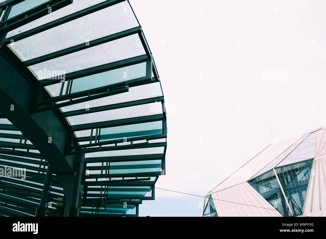 Low angle shot of a modern architecture glass rooftop Stock Photo - Alamy