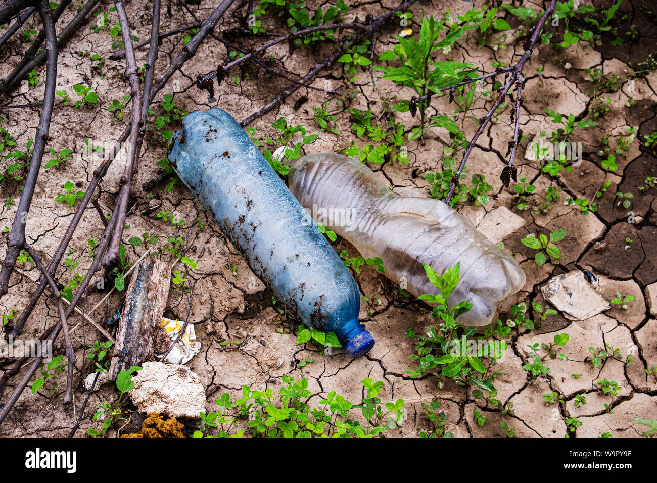 Plastic debris is lying on the ground Stock Photo - Alamy