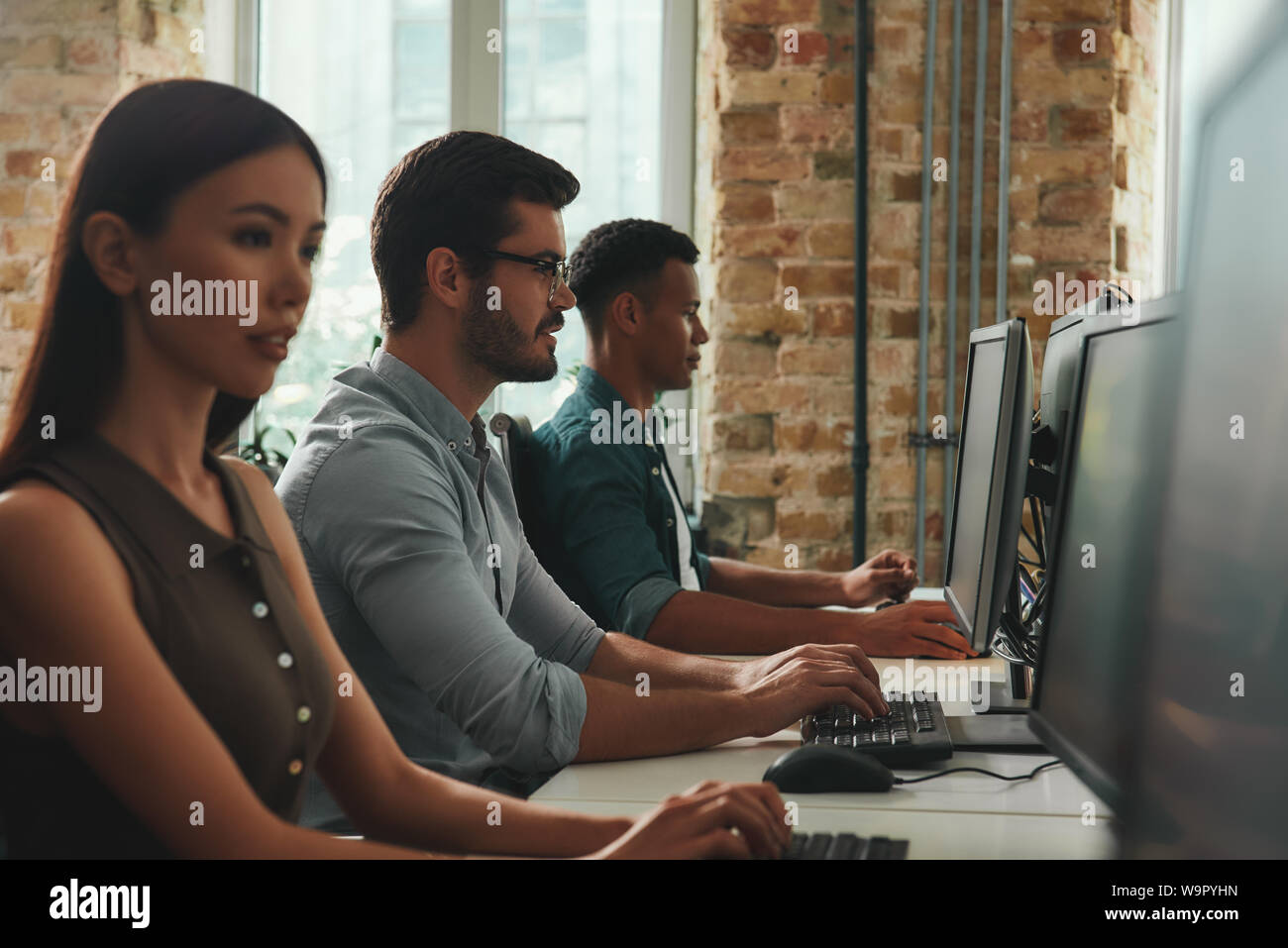 Company employees working in software hi-res stock photography and ...