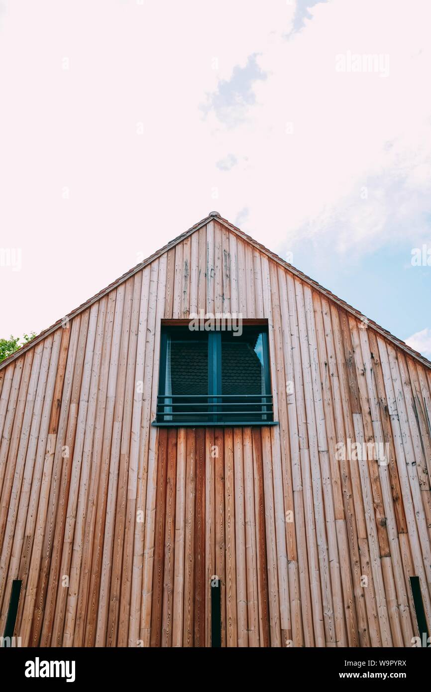Low angle shot of a wooden large building Stock Photo - Alamy