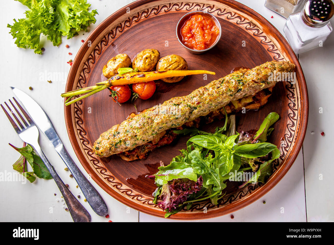 Turkish Traditional mix kebab with baked vegetables, mushrooms and ...