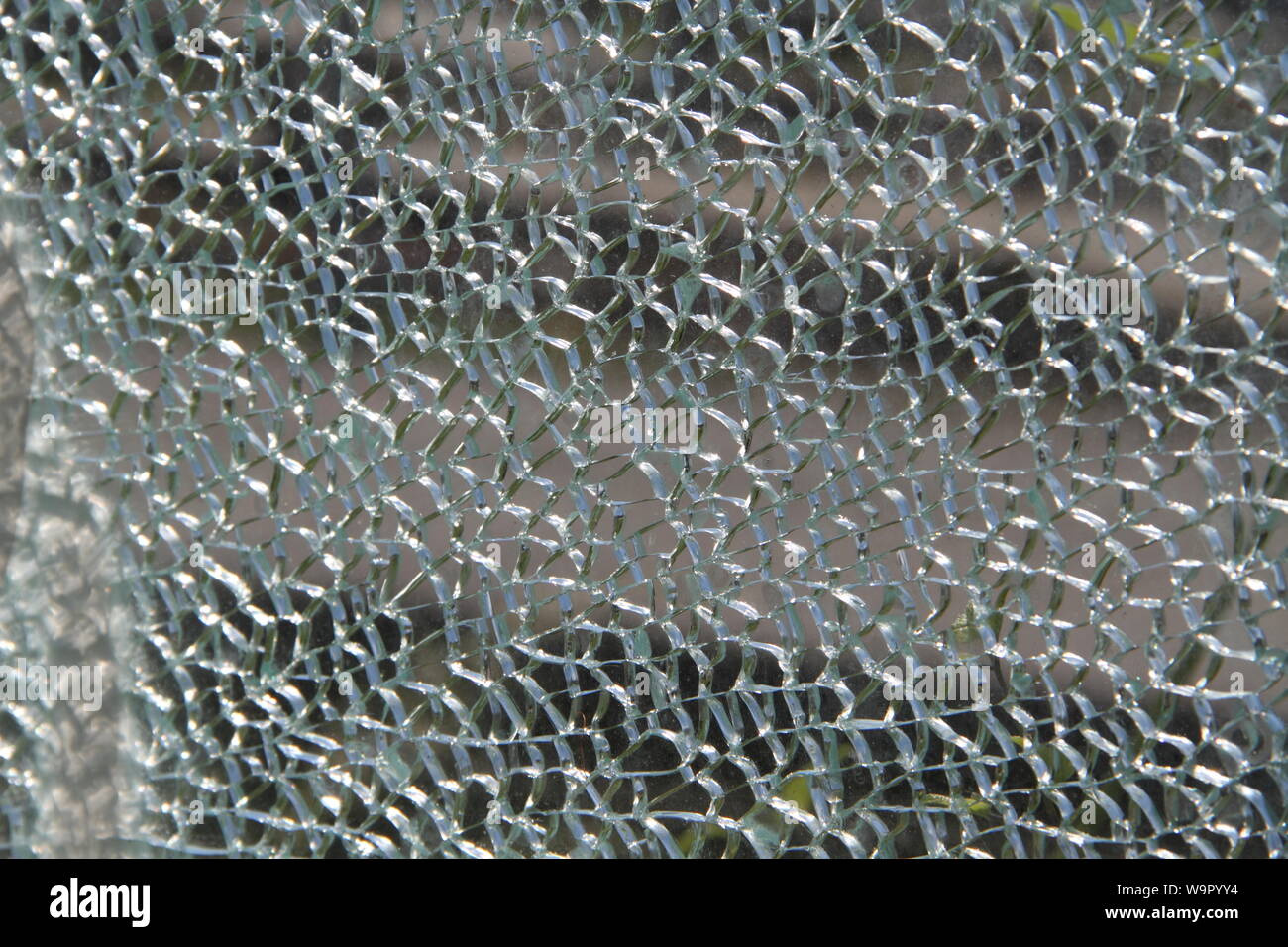 a fragmented car window made of safety glass Stock Photo - Alamy