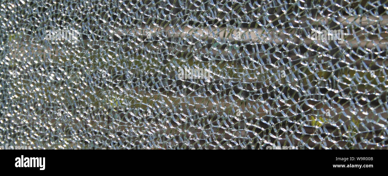 a fragmented car window made of safety glass Stock Photo - Alamy