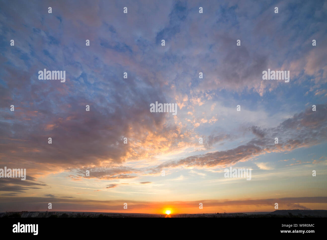 Dramatic sunset sky with orange clouds Stock Photo - Alamy