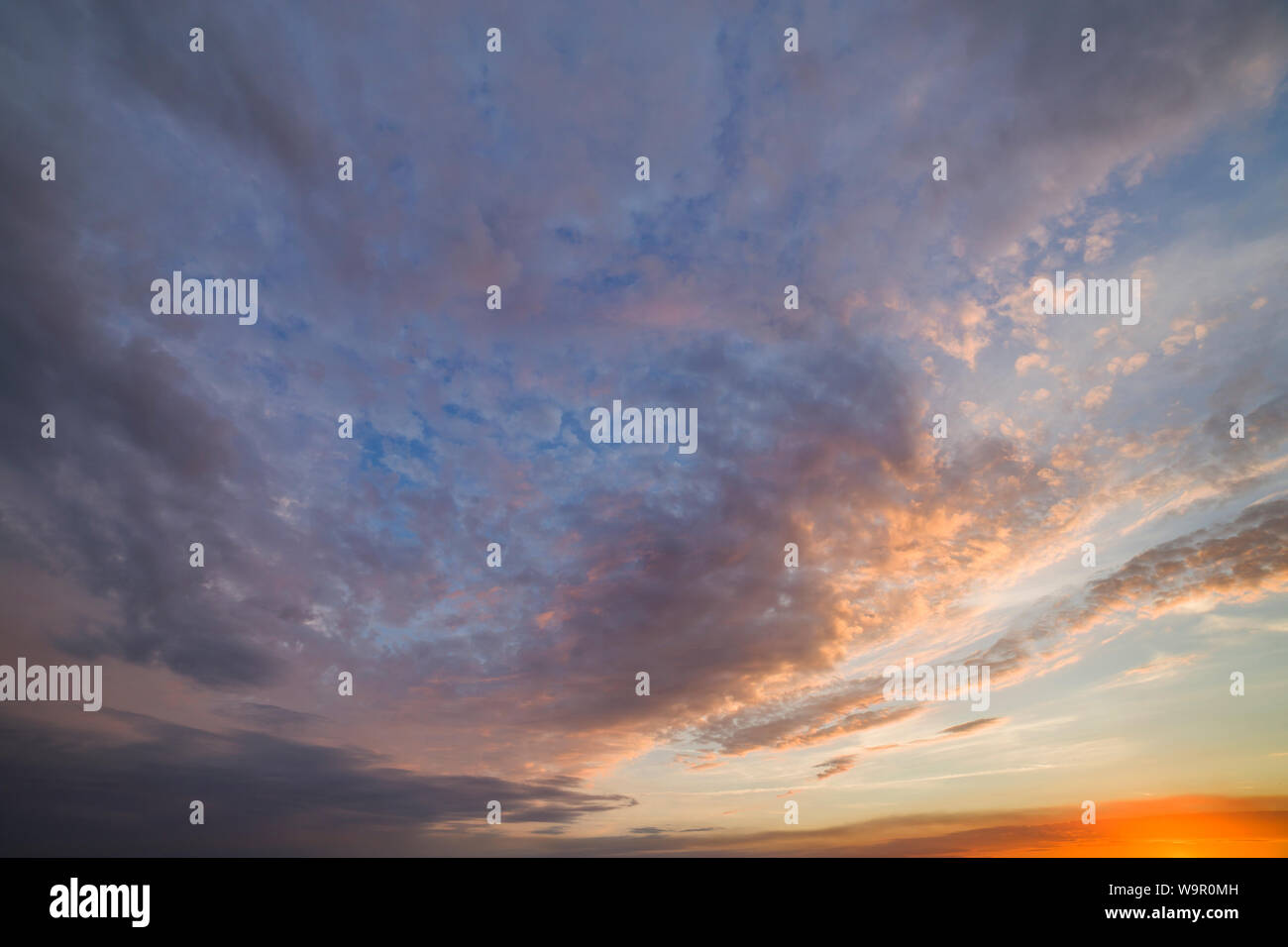 Dramatic sunset sky with orange clouds Stock Photo - Alamy
