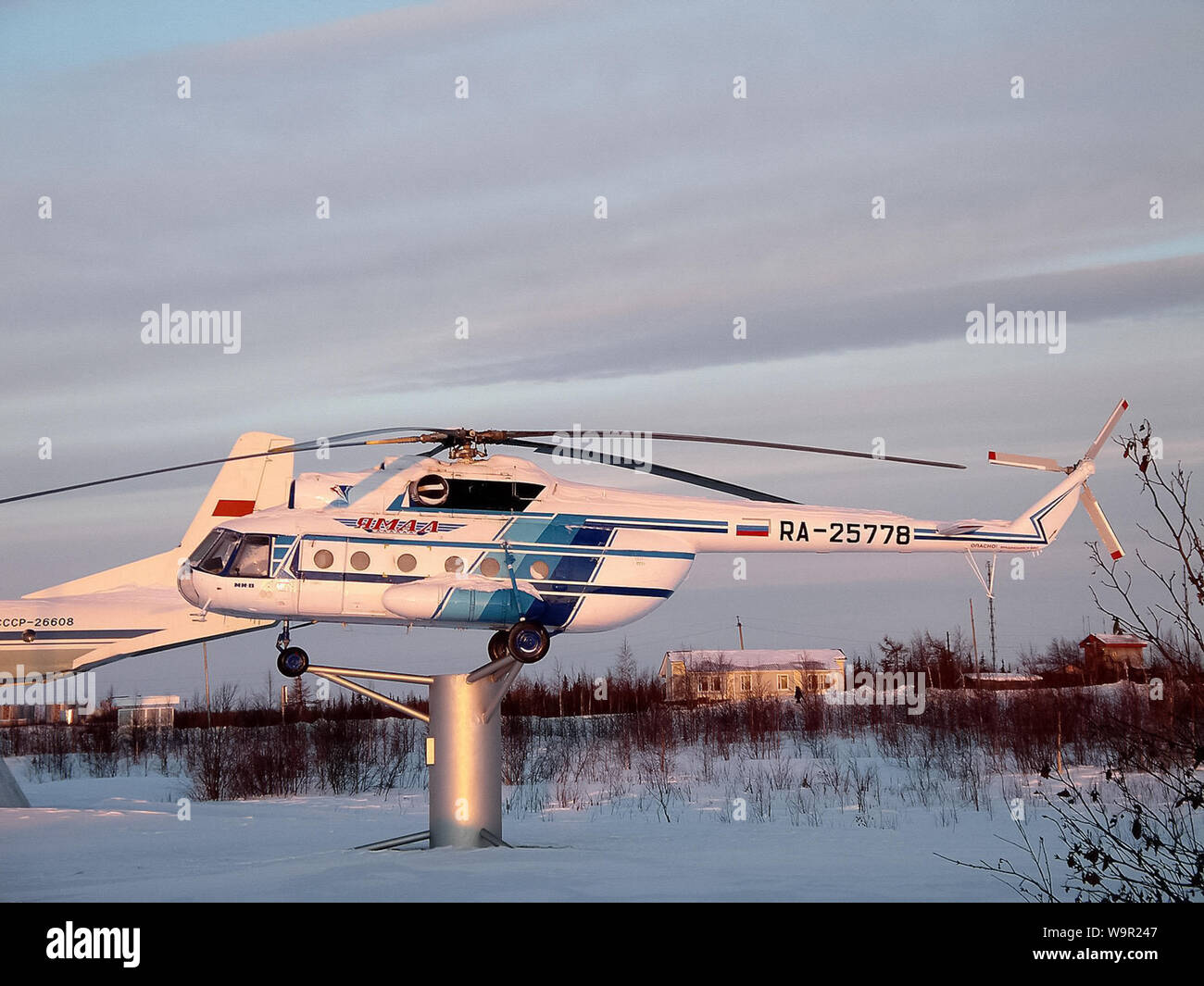 Salekhard, Russia - February 27, 2007: Helicopter on the pedestal. The ...