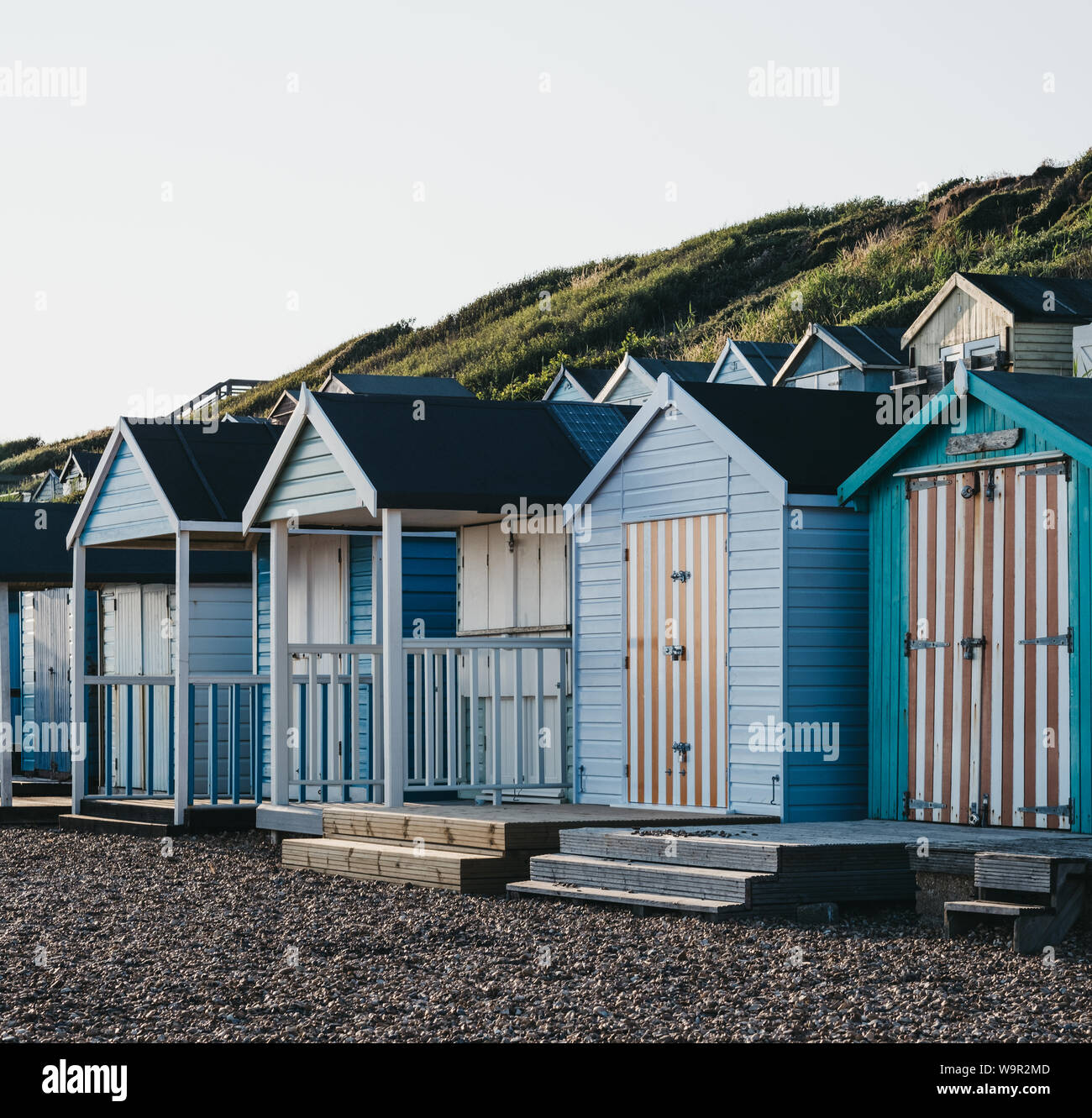 Colorful beach huts during sunset by the sea, holiday and travel ...