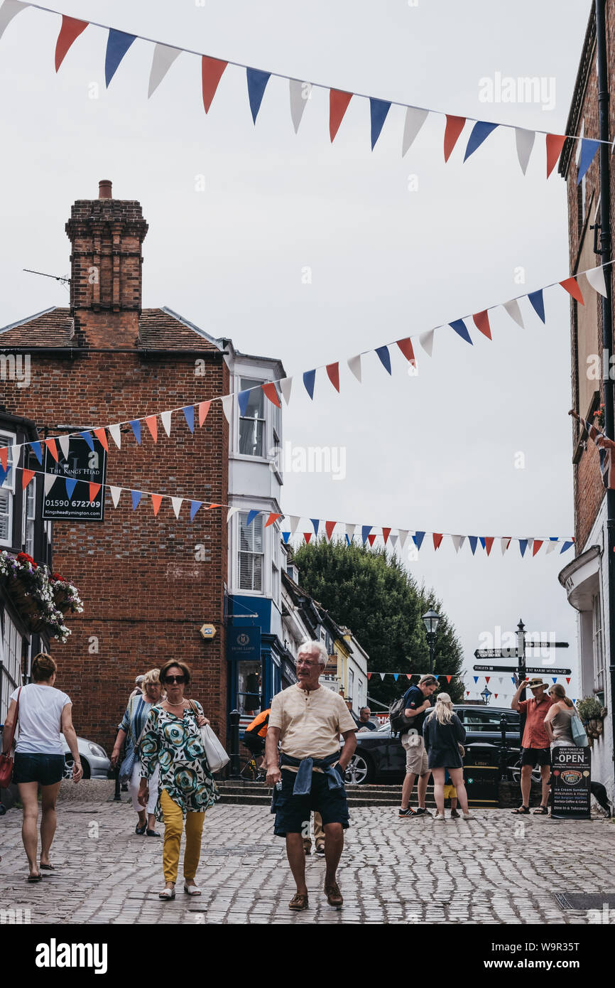 Lymington, UK - July 14, 2019: People walking under the colourful ...