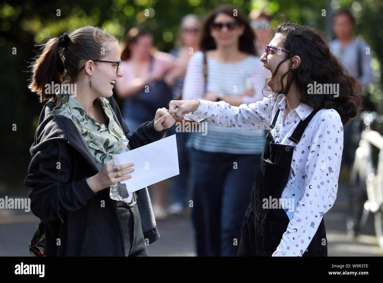 Eleanor Bracier, 18, (left) and Charlotte Hilton, 18, congratulate each ...