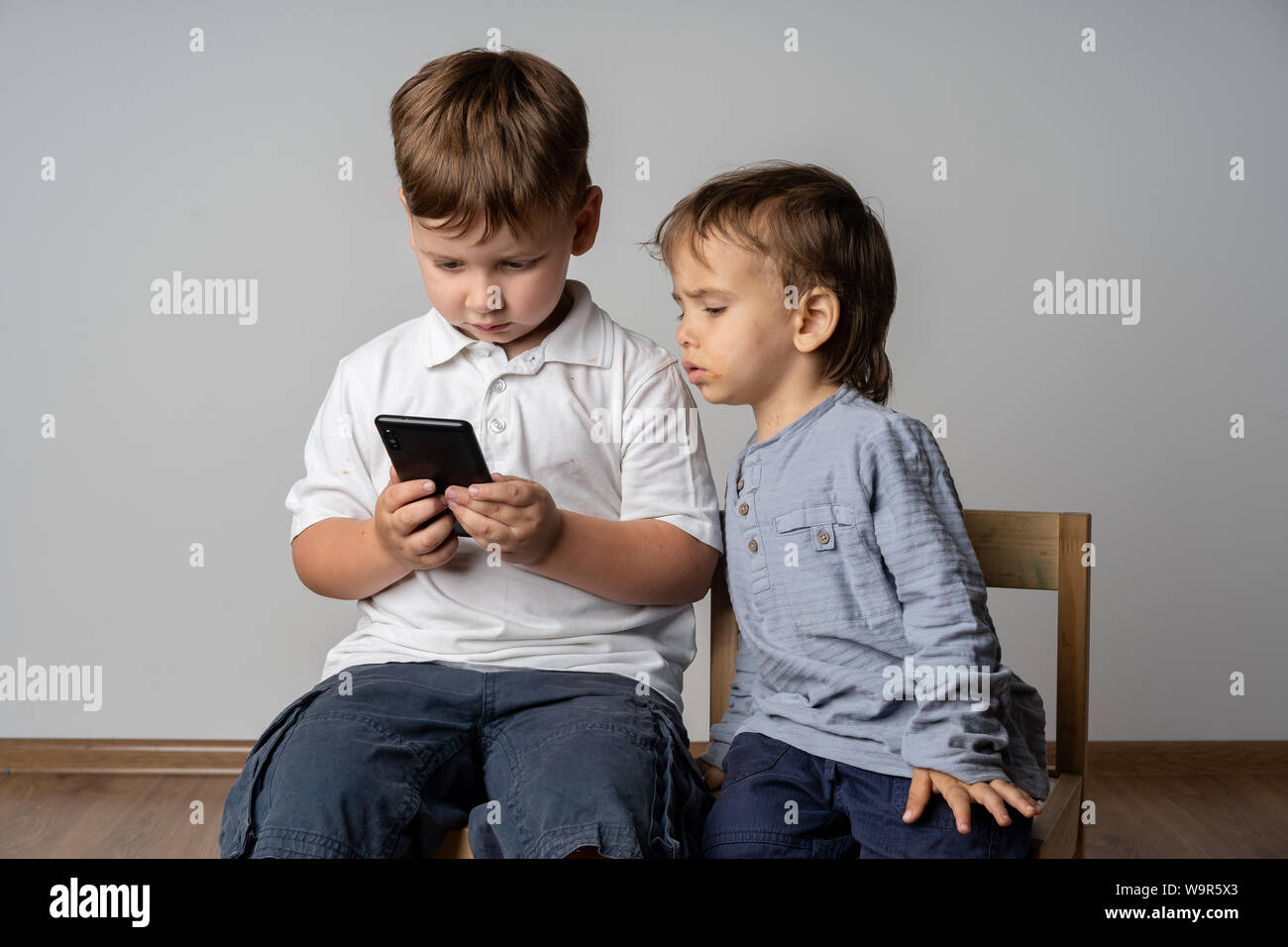 childhood, technology and family concept - little kids with tablet pc ...