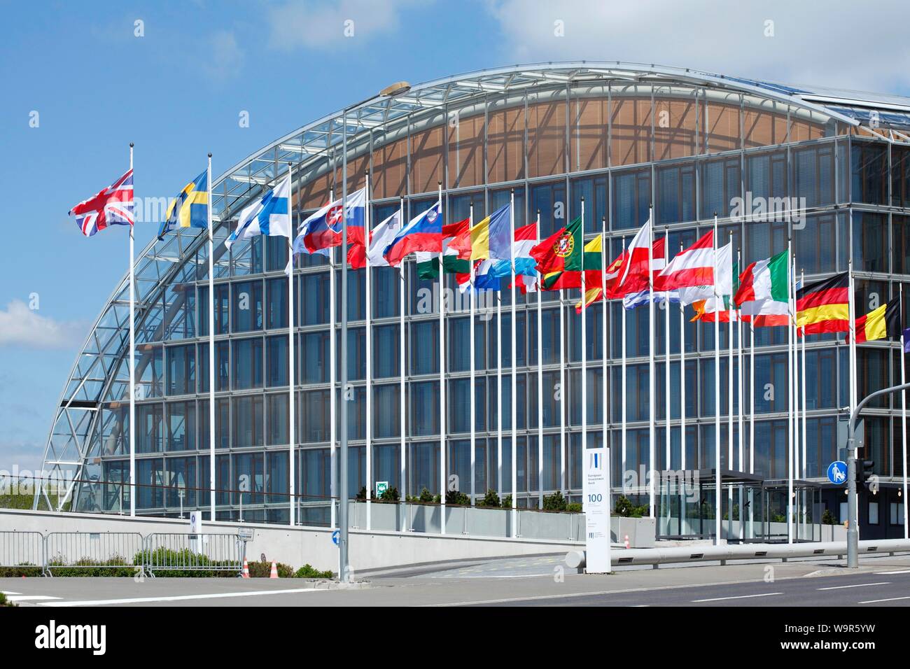 International flags waving in front of European Investment Bank ...