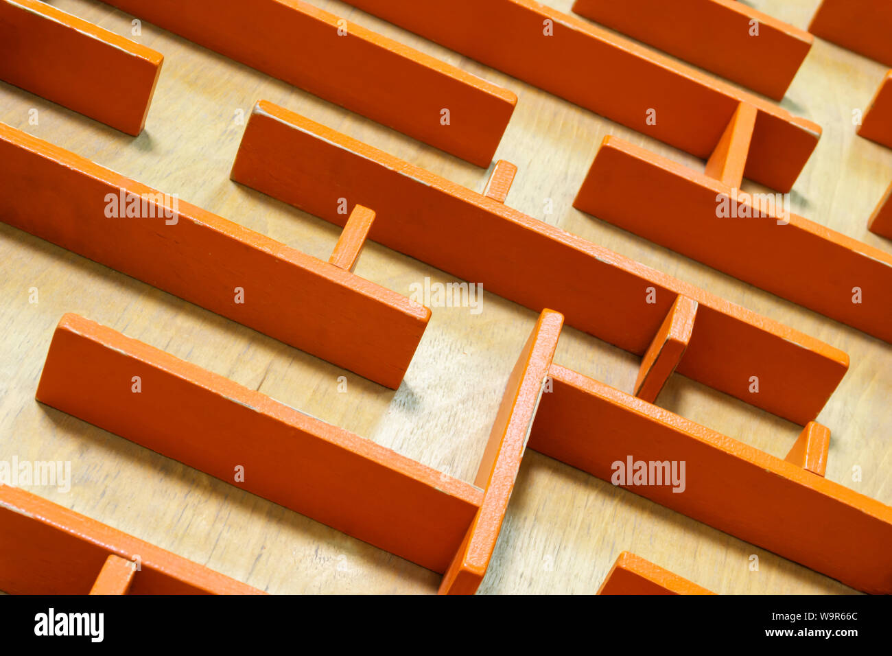 background - a top view of a maze of wooden partitions on a plywood ...
