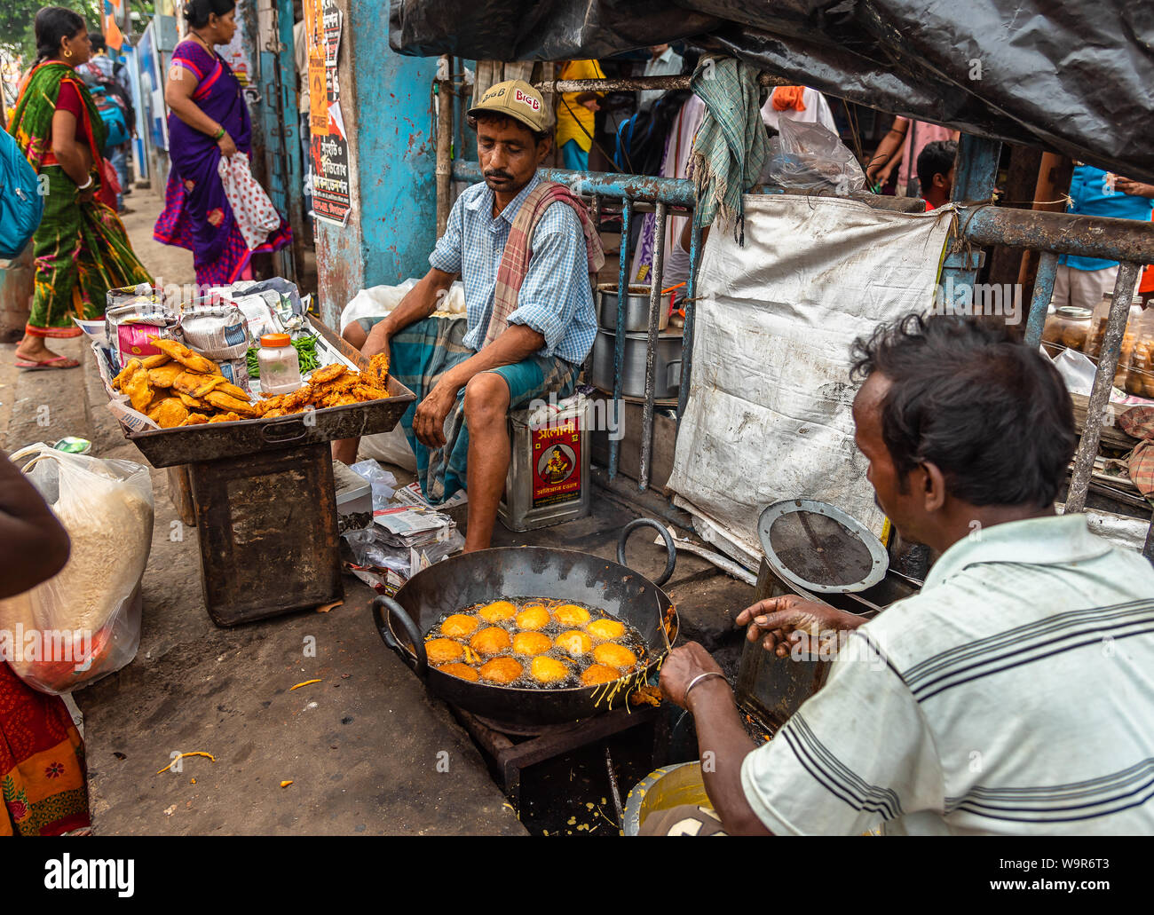 Kolkata, West Bengal/ India - August 11,2019. Road side Hawkers cooking ...