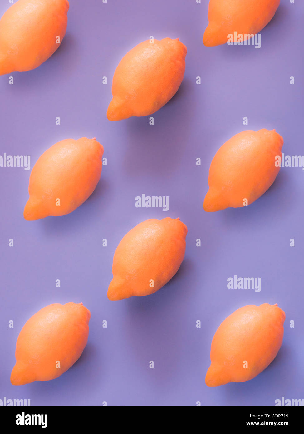 Orange lemon pattern on purple background Stock Photo - Alamy
