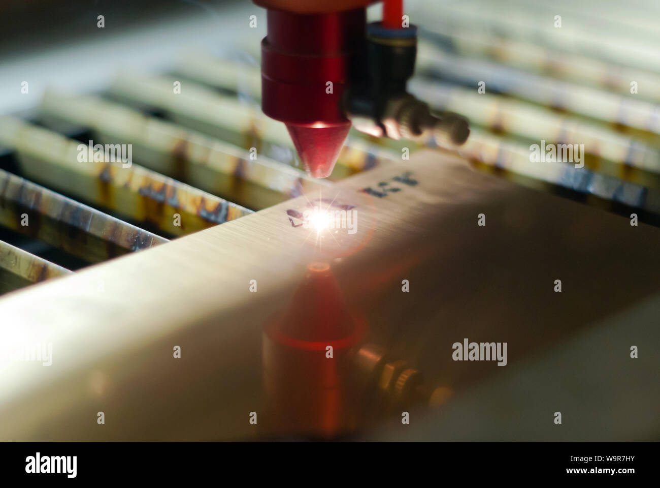 stage of manufacturing, laser engraving in automatic mode, close-up ...