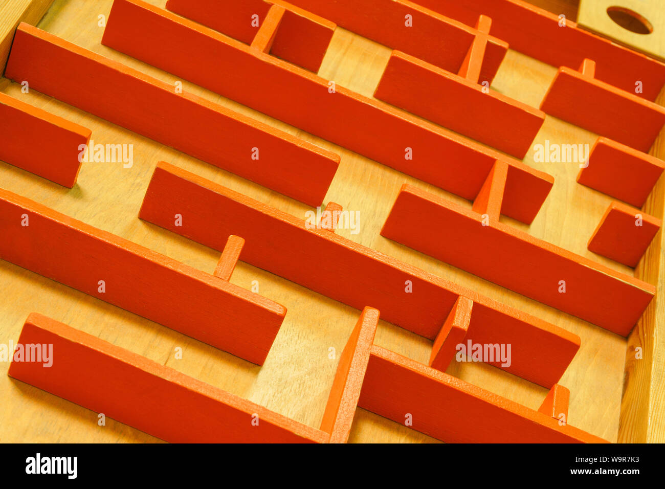 background - a top view of a maze of wooden partitions on a plywood ...