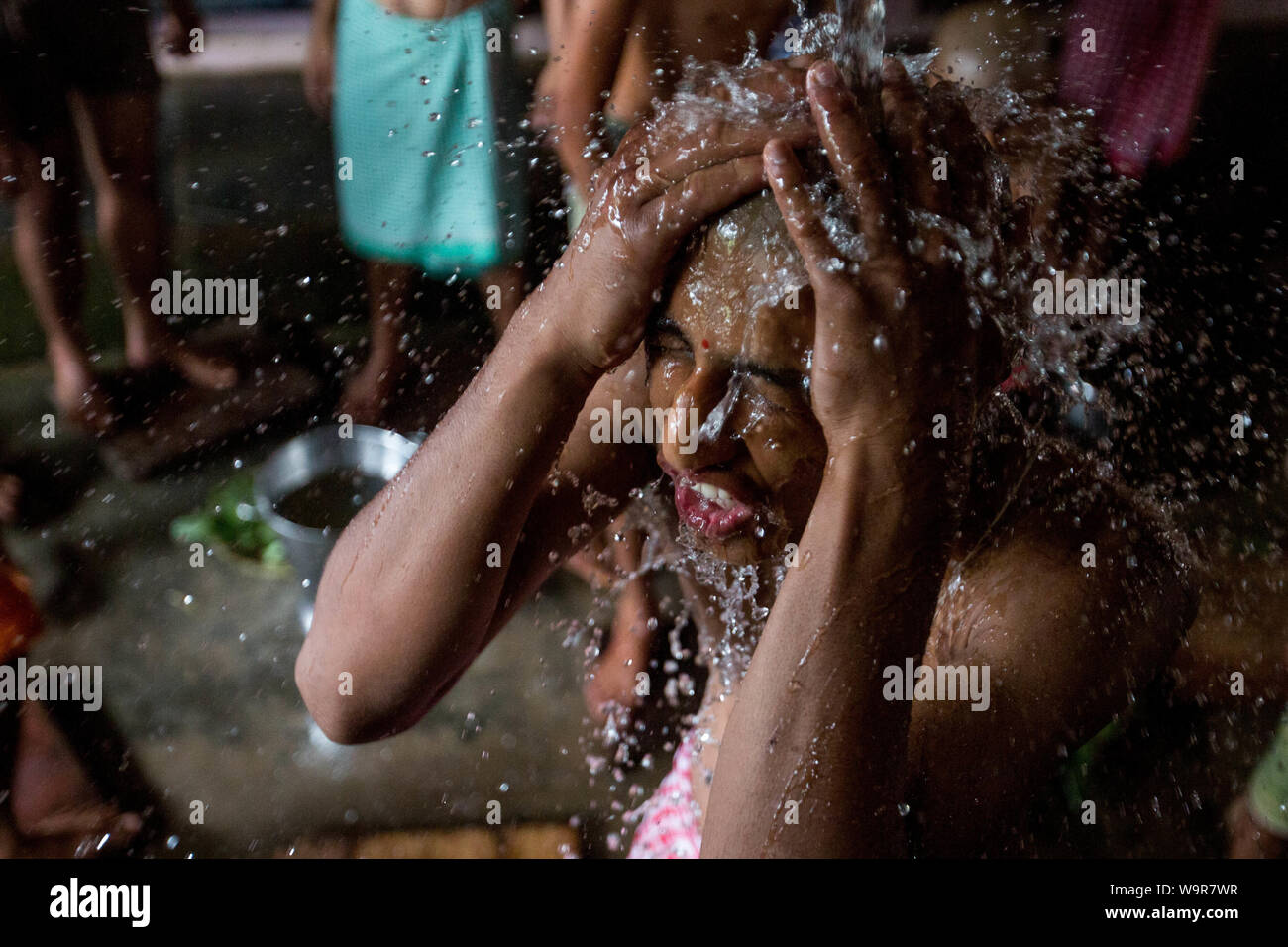 Kathmandu, Nepal. 15th Aug, 2019. Young Nepali Hindu priest takes holy ...