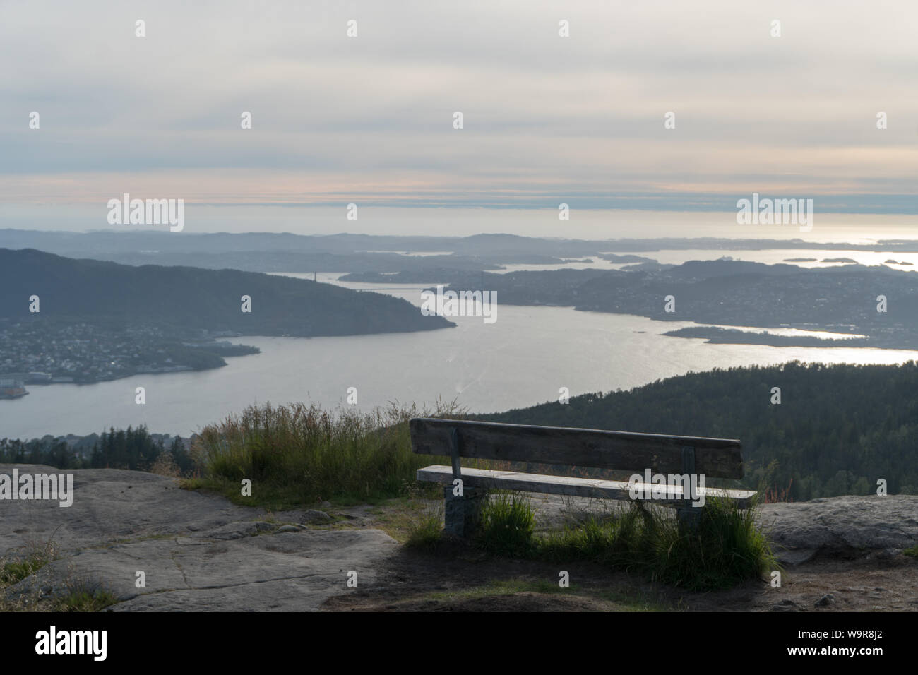 Mountain Top view of islands surrounding Bergen, Norway, with a bench ...