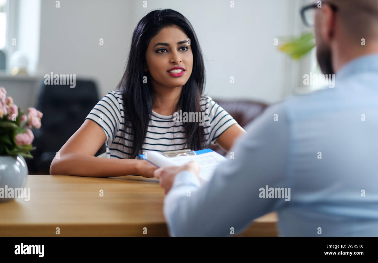 Indian girl attending job interview Stock Photo - Alamy