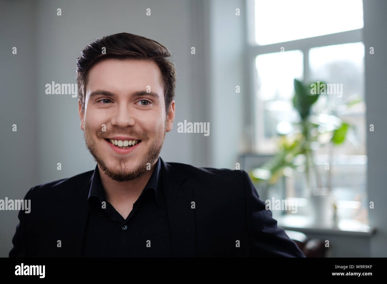 Confident young man attending job interview Stock Photo - Alamy