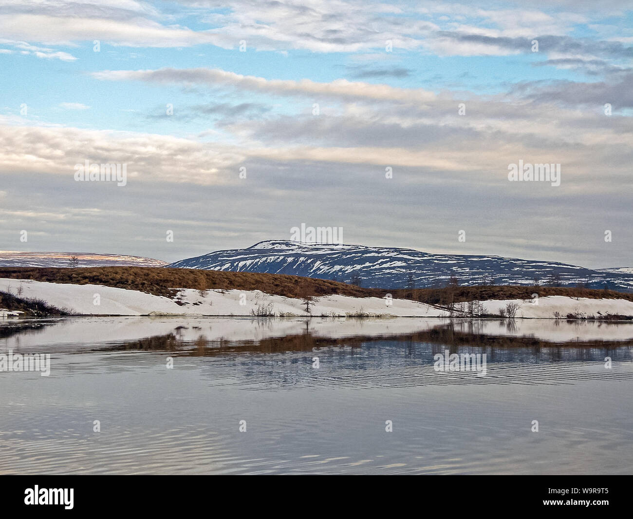 River landscape Early spring. bare trees, melting snow Stock Photo - Alamy