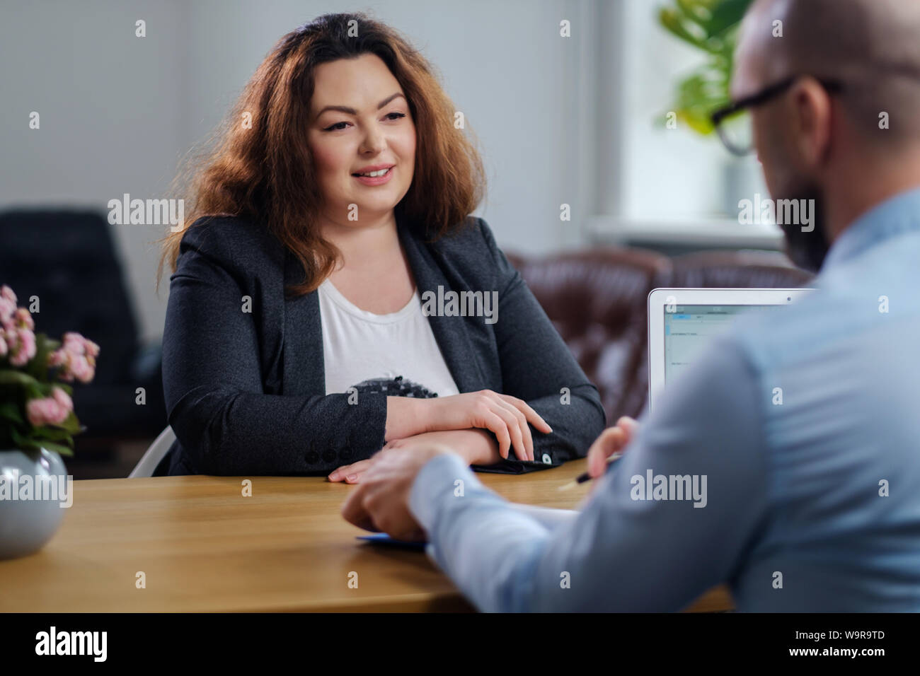 Plus size woman attending job interview Stock Photo - Alamy