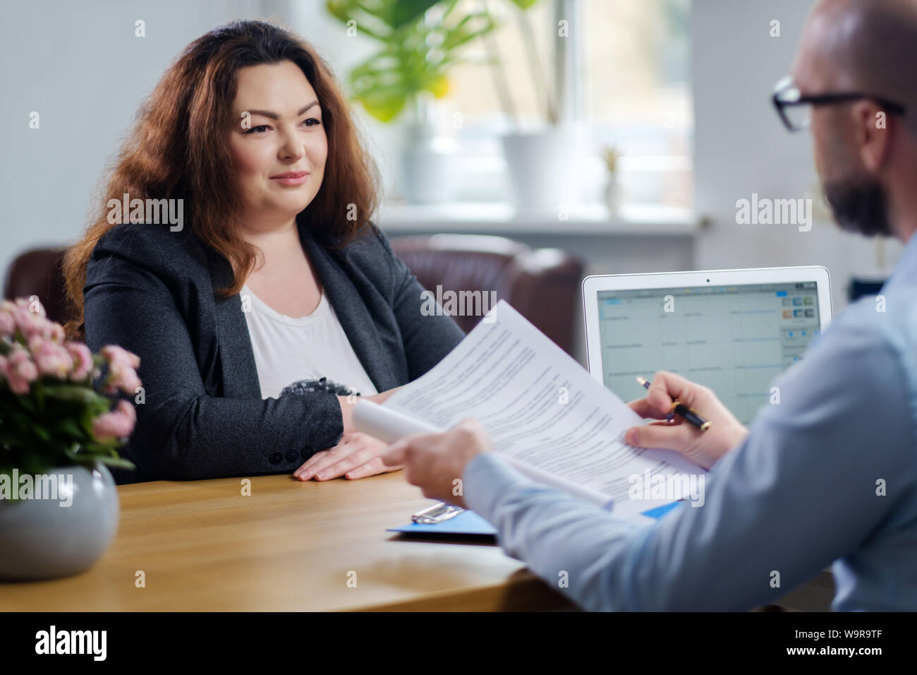 Plus size woman attending job interview Stock Photo - Alamy