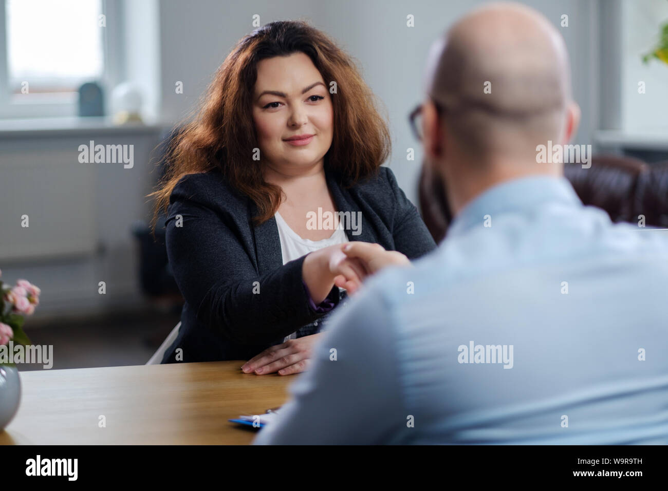 Plus size woman attending job interview Stock Photo - Alamy