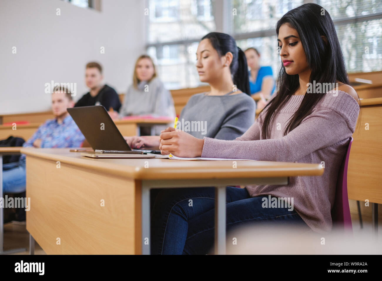 Multinational group of students in an auditorium Stock Photo - Alamy