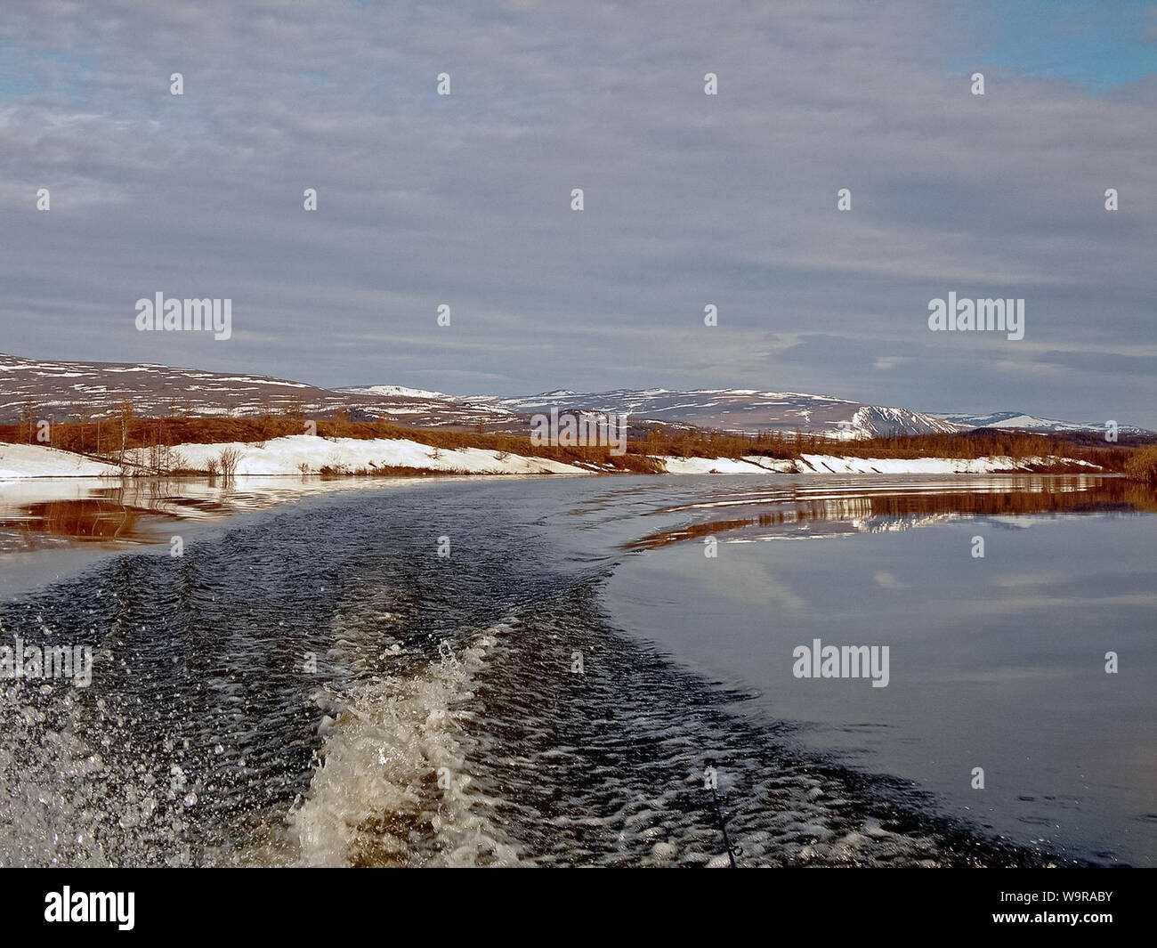 River landscape Early spring. bare trees, melting snow Stock Photo - Alamy