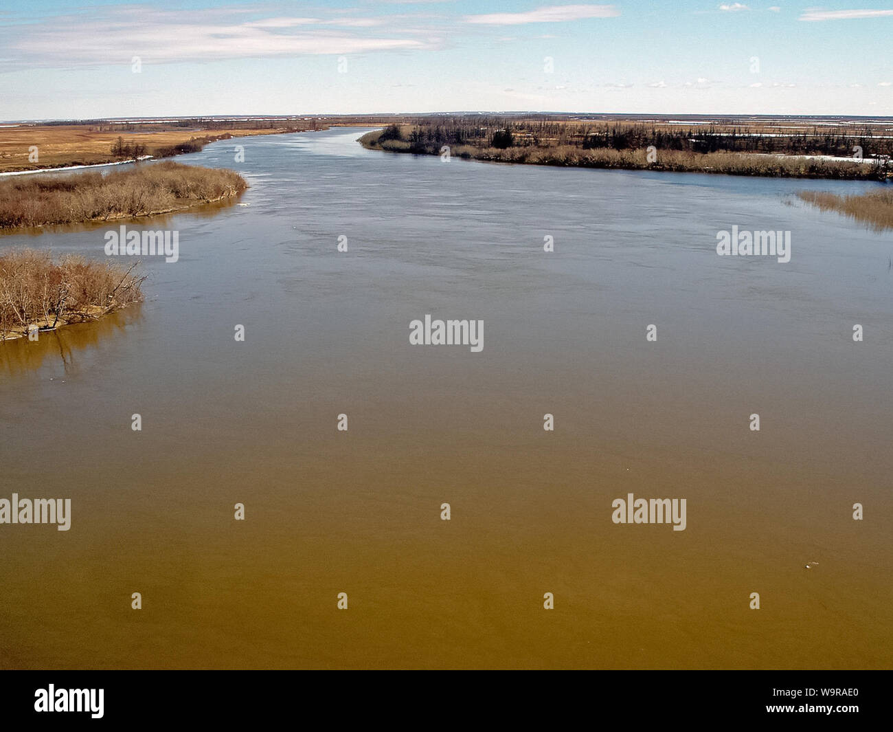 River landscape Early spring. bare trees, melting snow Stock Photo - Alamy