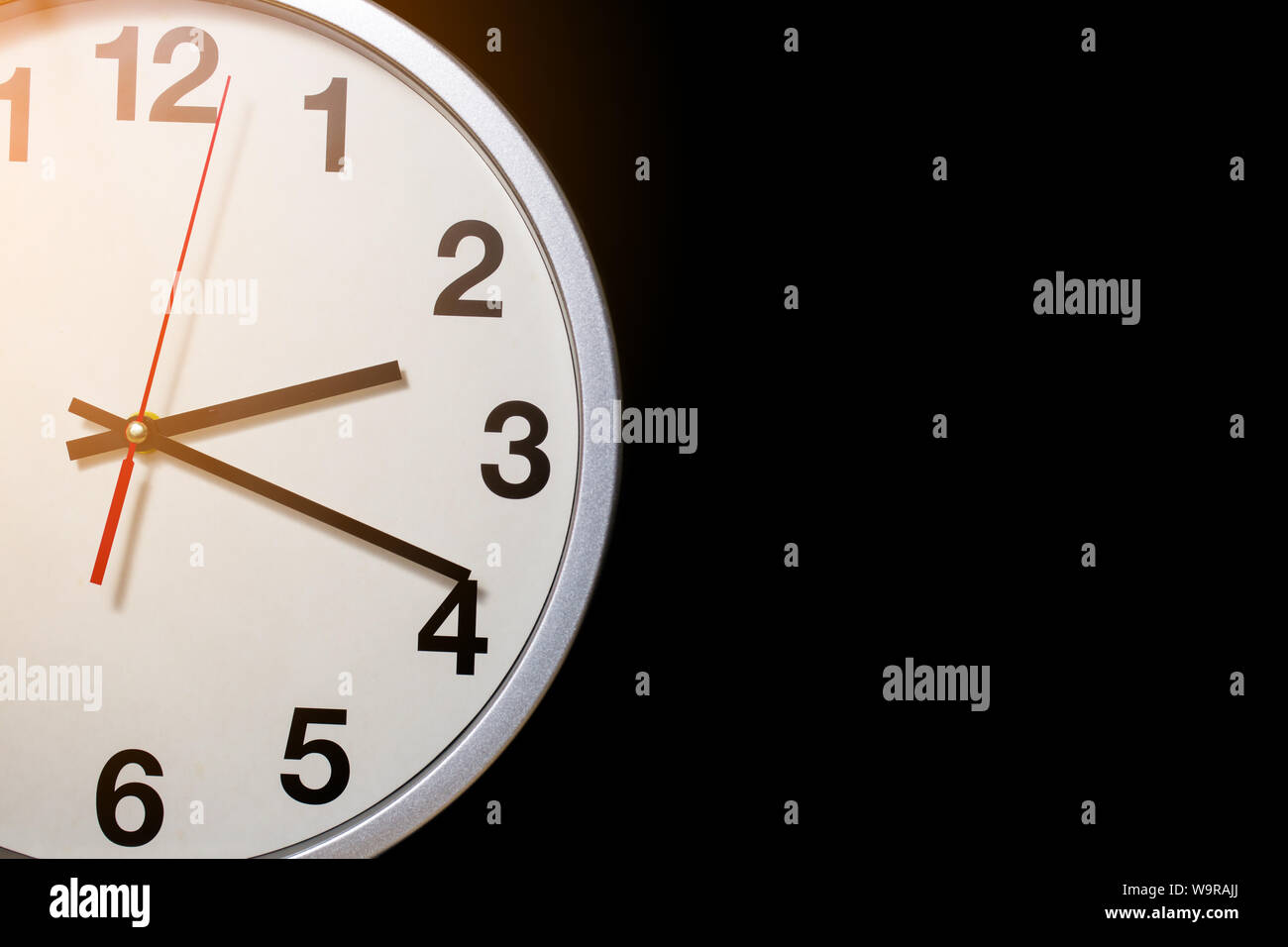 White circle clock on dark hi-res stock photography and images - Alamy